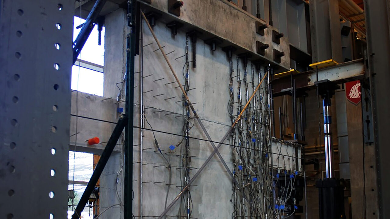 Nonlinear Wind Design of Steel Reinforced Concrete Coupling Beams